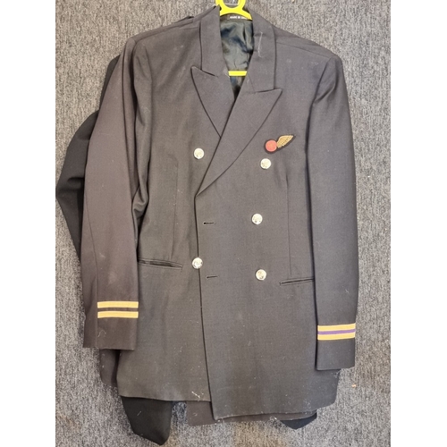 A vintage British Airways pilot's jacket, cap and trousers, together ...