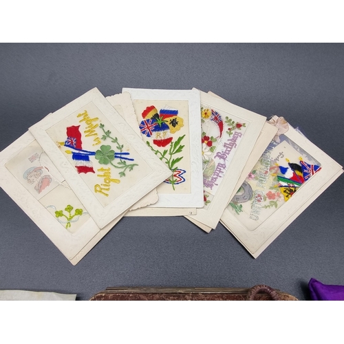 Ten WWI and WWII silk postcards; together with three embroidered silk sweetheart handkerchiefs, one