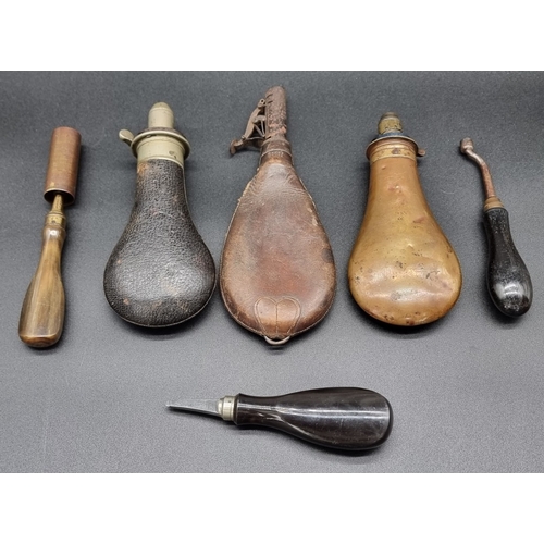 A 19th century leather and steel shot flask, 22cm high; together with ...