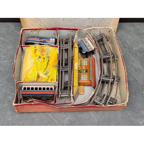 A circa 1930 Brimtoy 'O' Gauge tinplate train set, SP64/211.