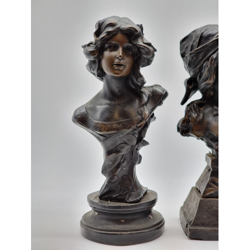 Two Art Nouveau style bronzed resin busts, 39cm high.