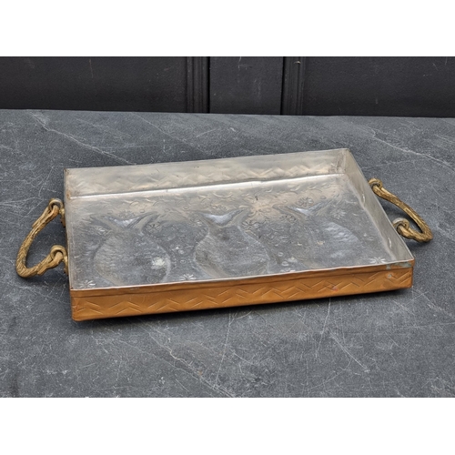 A Newlyn copper twin handled tray, repousse decorated with fish, 32cm ...