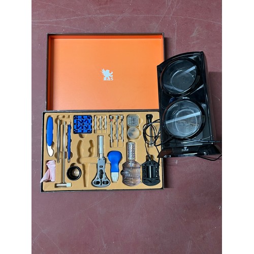 A Boxed Horologists Tool kit and a time Tutelary electric watch winder