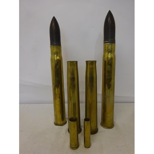 Collection of 6 old brass shell cases.