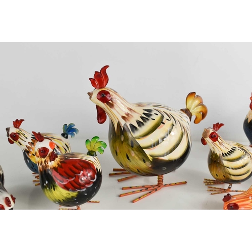 A collection of nine Gallo ceramic rocking roosters and hens.