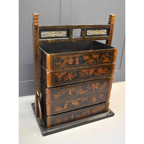 A 19th century Chinese black lacquered stacking chest, the decorative ...