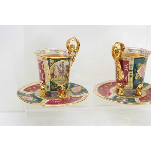 A set of four Vienna porcelain coffee cans and saucers, a pair of ...