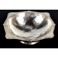 A Scottish Arts and Crafts planished white metal bowl, likely a silver ...