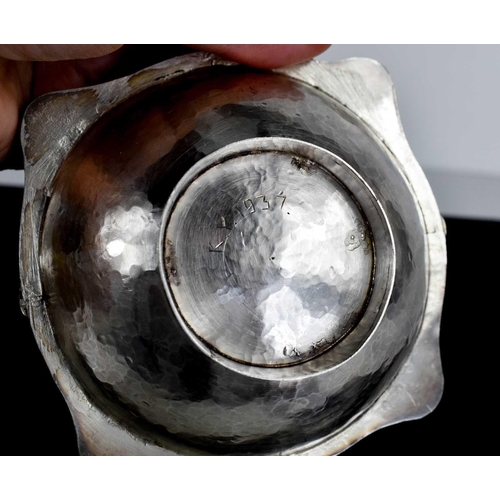 A Scottish Arts and Crafts planished white metal bowl, likely a silver ...
