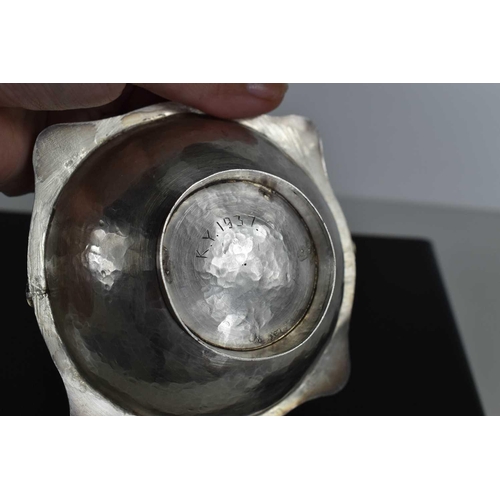 A Scottish Arts and Crafts planished white metal bowl, likely a silver ...