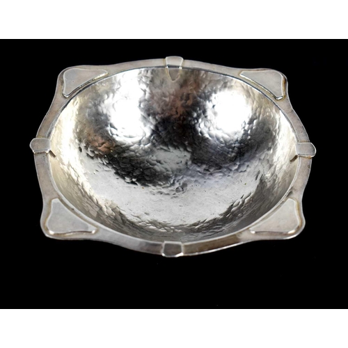 A Scottish Arts and Crafts planished white metal bowl, likely a silver ...