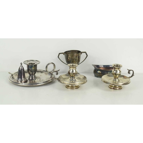 A pair of small silver chambersticks, with gadroon edge and scroll ...