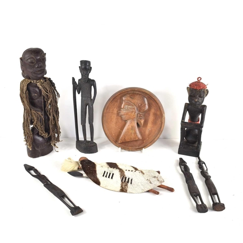 A collection of African tribal items to include a miniature shield and ...