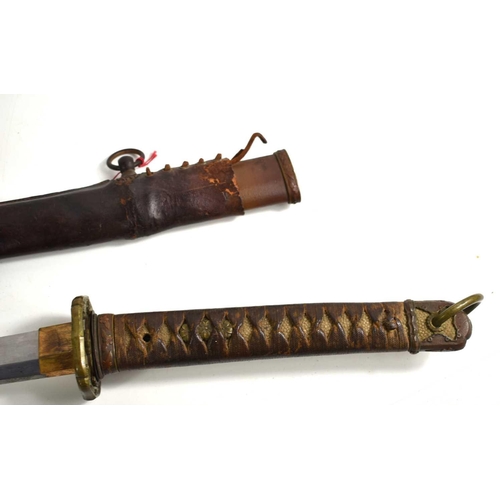 A WWII era Japanese Shin-Gunto Katana Sword, the blade having a wavy ...