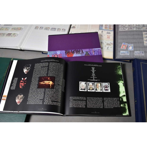 A collection of stamp albums containing mint GB commemorative stamps ...