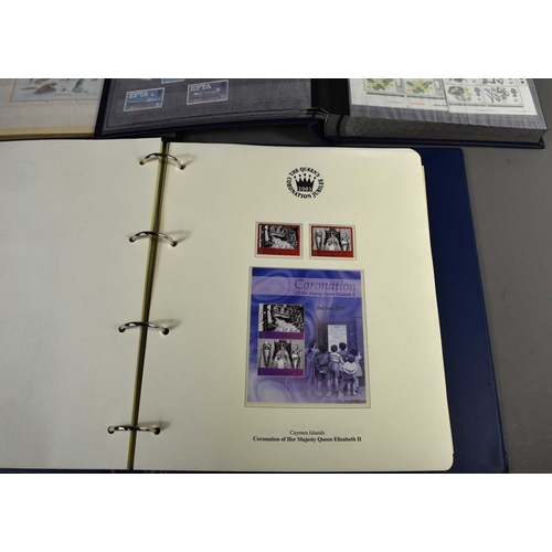 A collection of stamp albums containing mint GB commemorative stamps ...