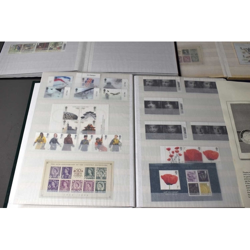 A collection of stamp albums containing mint GB commemorative stamps ...