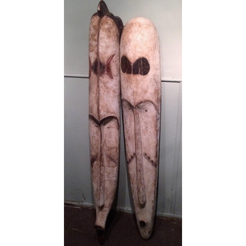 Pair of very large fang masks, Tallest measuring 158cm