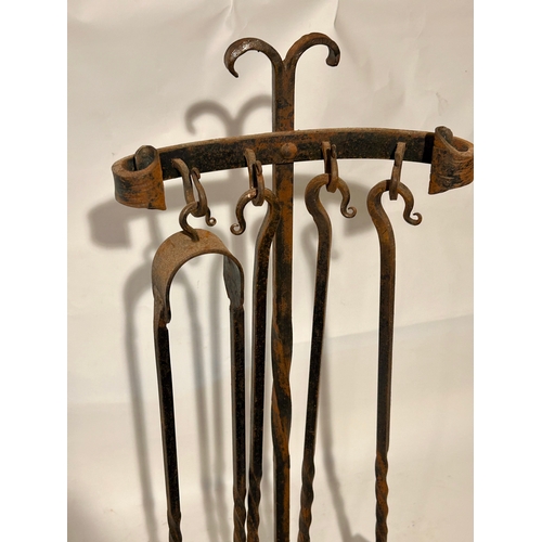 Twisted Steel Four Piece Fire Companion Set On Stand. 79cm x 29cm.