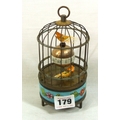 Edwardian brass & metal bird automaton clock with 2 birds in a cage
