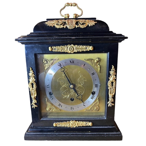 F.W. ELLIOT, AN EIGHT DAY EBONISED CHIMING BRACKET CLOCK With gilt ...