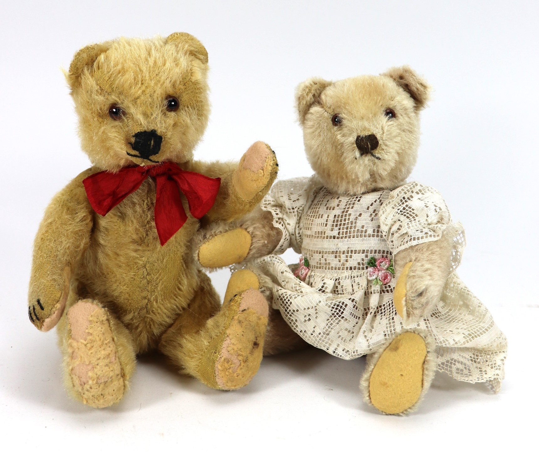 Two small post-war Steiff Teddy bears, golden mohair bear with brown glass eyes, black stitched nose