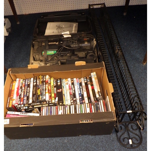 Various DVDs; a wrought metal CD / DVD rack; a Panasonic camcorder.