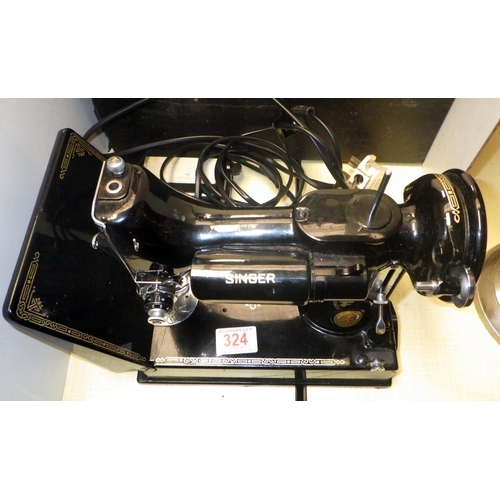 A Singer electric sewing machine together with a Taylor Bird table top ...