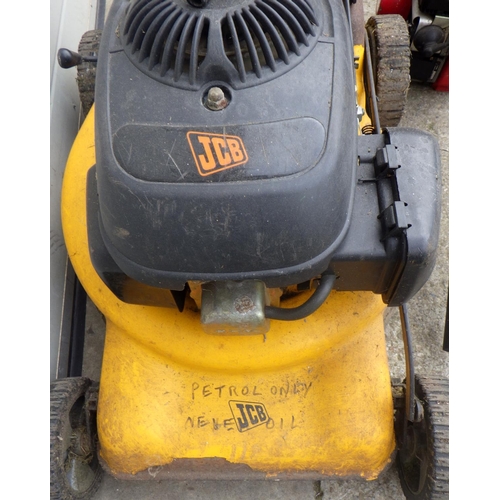 A JCB petrol lawn mower, missing grass box, sold as seen, together with ...