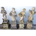 Four concrete garden statues, representing the four seasons, two types ...