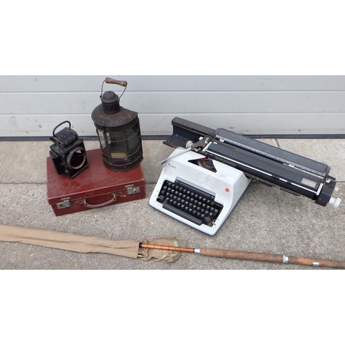 A typewriter, two lamps, fishing rod and a suitcase (5)