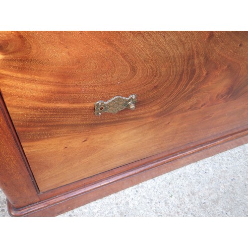 A Victorian mahogany single wardrobe with mirrored door, missing handle ...