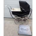 A large vintage Marmet pram with canopy