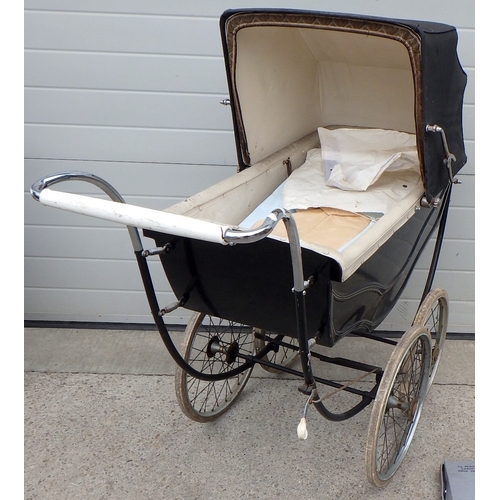 A large vintage Marmet pram with canopy