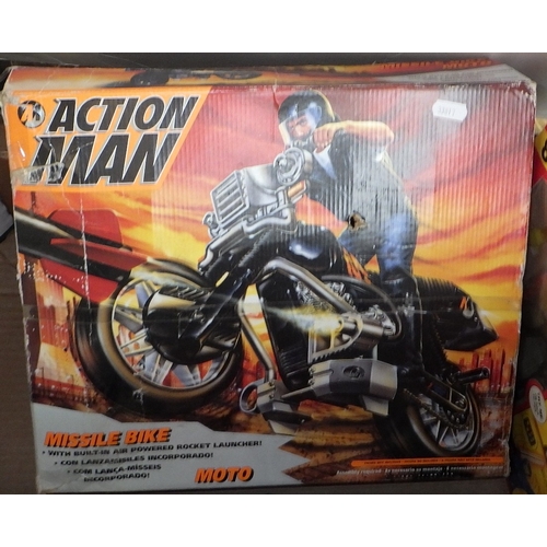 An Action Man Missile Bike and two boxed Action Man dolls together with ...