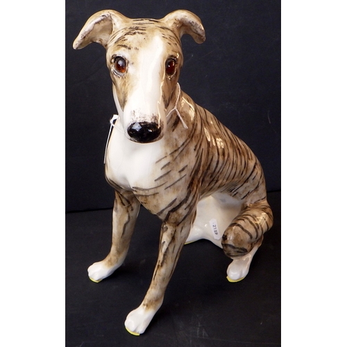 A large Winstanley figure of a sitting greyhound dog