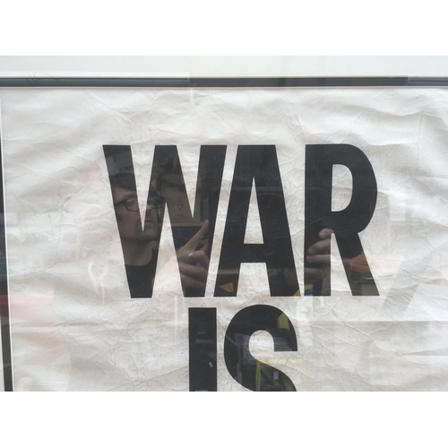 A framed John Lennon And Yoko Ono 'War Is Over' Promotional Poster ...