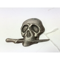 A WW2 Italian fascist black brigade weeping skull hat badge.