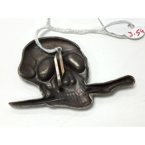 A WW2 Italian fascist black brigade weeping skull hat badge.