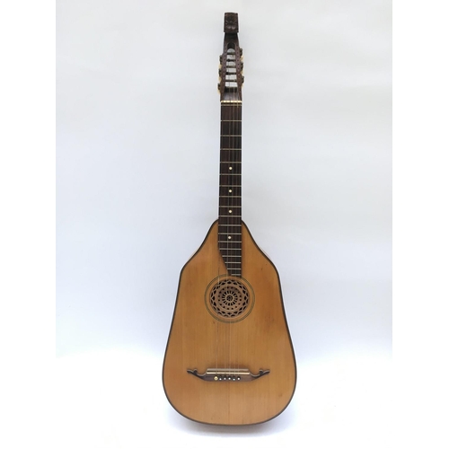 A circa 1950s German Perl Gold lute guitar with soft carry case.