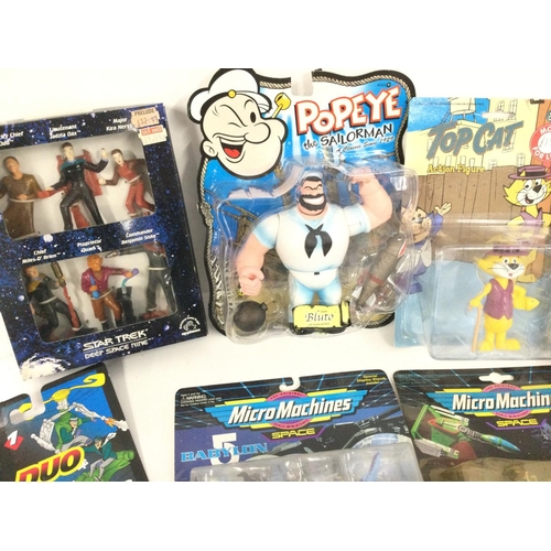 A Collection of Various Carded Toys. Including Star Trek. Popeye. Micro ...
