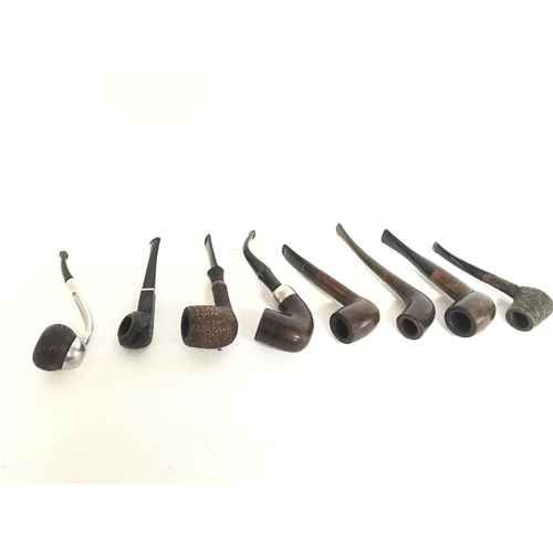 A collection of vintage smoking pipes including a Peterson silver ...
