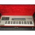 A cased Akai X7000 sampling keyboard with instruction manual.