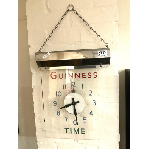 A 1950s electric operated perspex clock 'Guiness Time, height 40cm x ...
