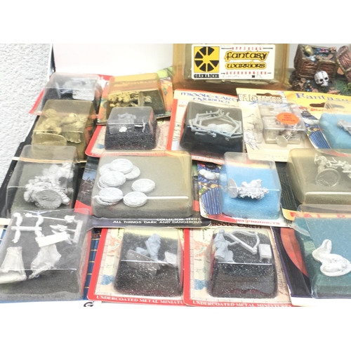 A collection in excess of 50 packaged metal model figures in original ...
