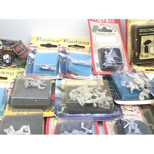 A collection in excess of 50 packaged metal model figures in original ...