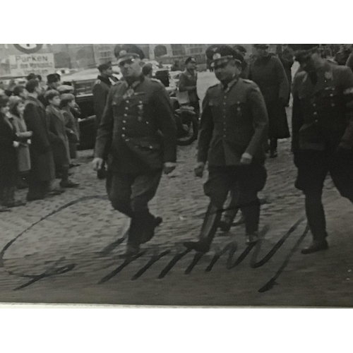 A Signed black and white photograph depicting a group of senior German ...