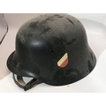A German Third Reich steel helmet M42 pattern with side decals black ...