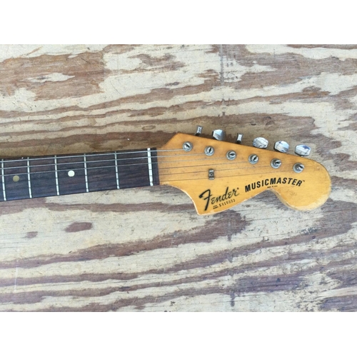 A 1978 Fender Musicmaster electric guitar modified with two jack plates ...