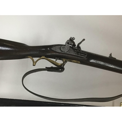 A replica Tower Flint lock Rifle Musket with brass fittings and steel ...